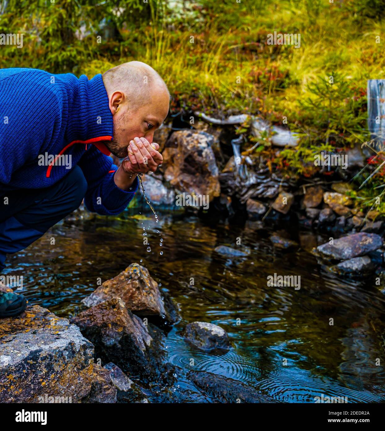Man drinking from natural spring hi-res stock photography and images ...