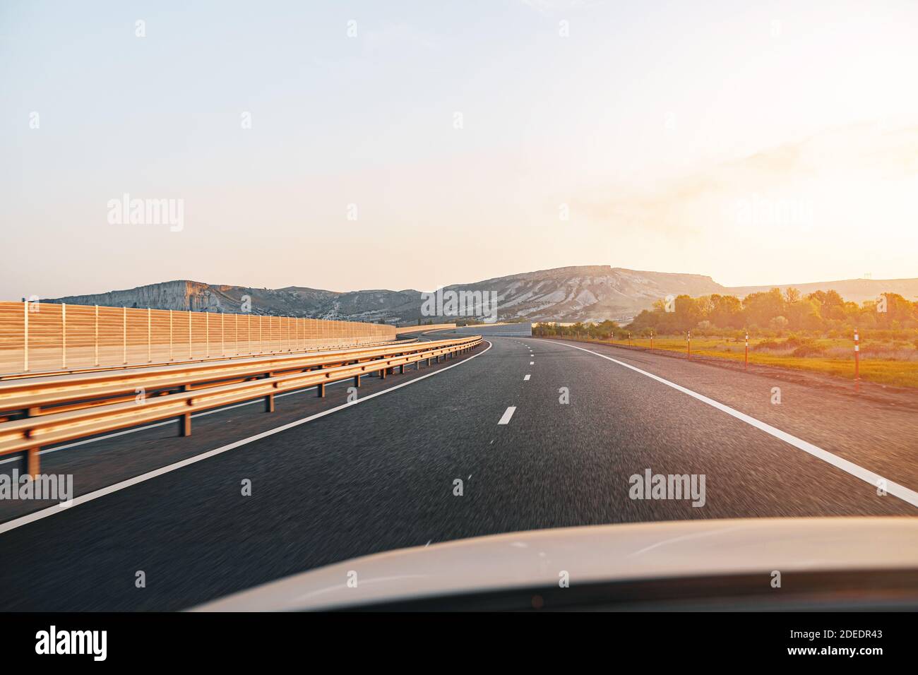Empty highway at dawn, view from driver's perspective Stock Photo - Alamy