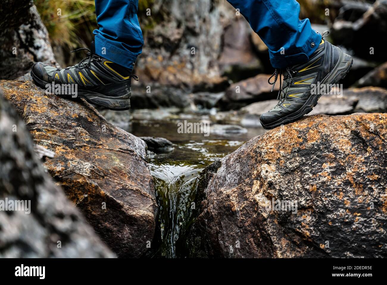 Boots on stream crossing hi-res stock photography and images - Alamy