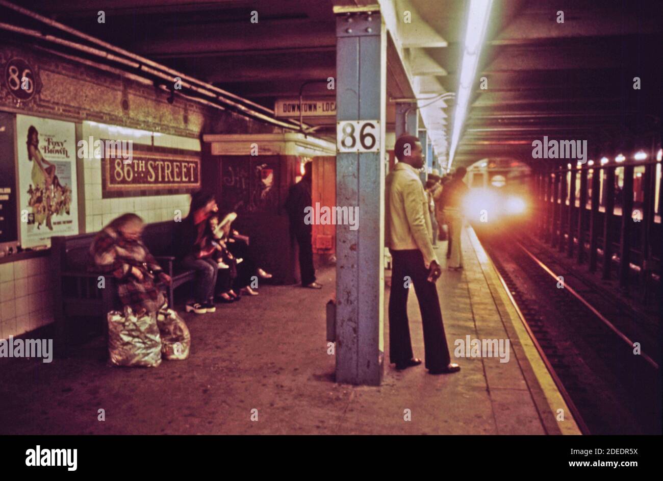 Passengers wait for a Lexington Avenue line subway on one of the ...