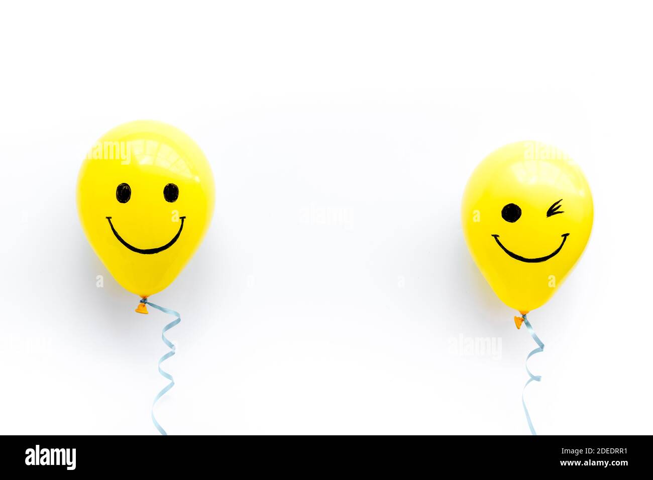 Positive emotions set. Happy and winking emoticons painted on colored ...