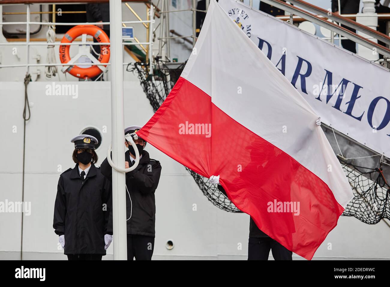 Sailor students raising the flag of Poland in Gdynia, northern Poland ...