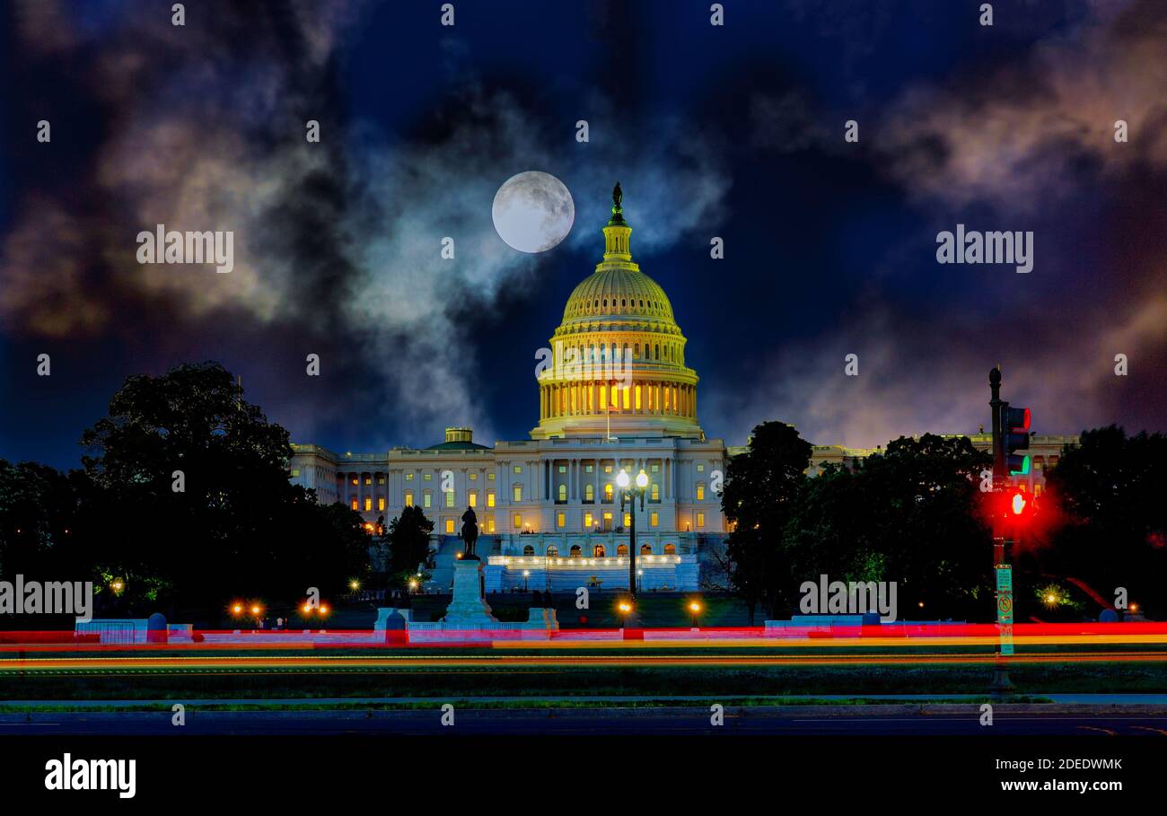 The United States Capitol building with the dome lit up at moon in the ...