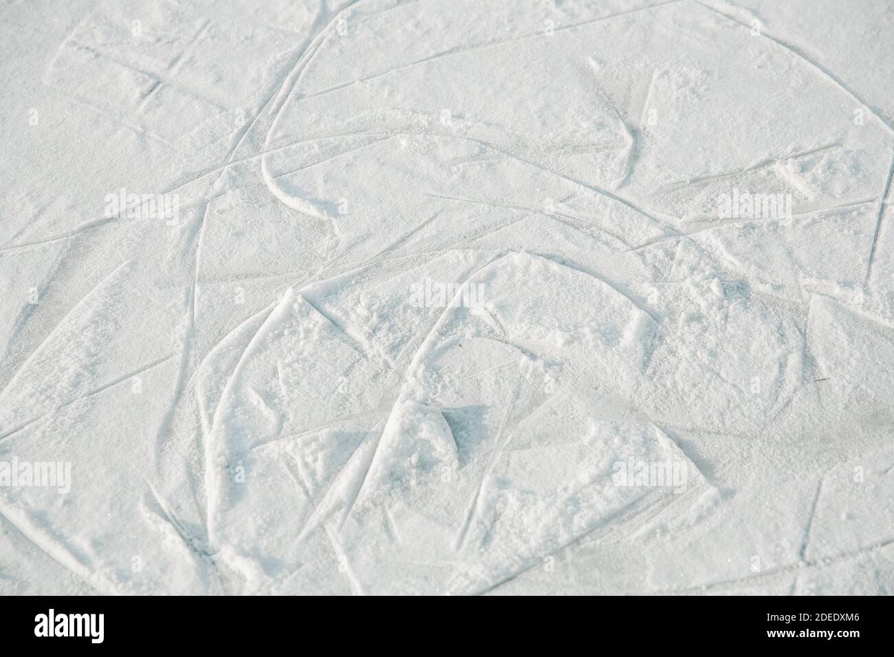 Ice Rink Texture with traces of ice skating. Selective focus of Skate ...