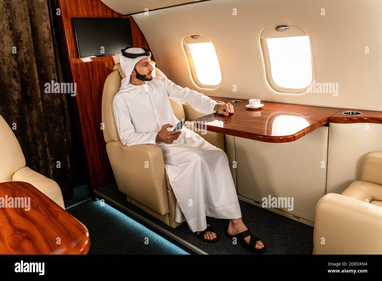 Arabic man wearing kandora in emirates style flying on exclusive ...