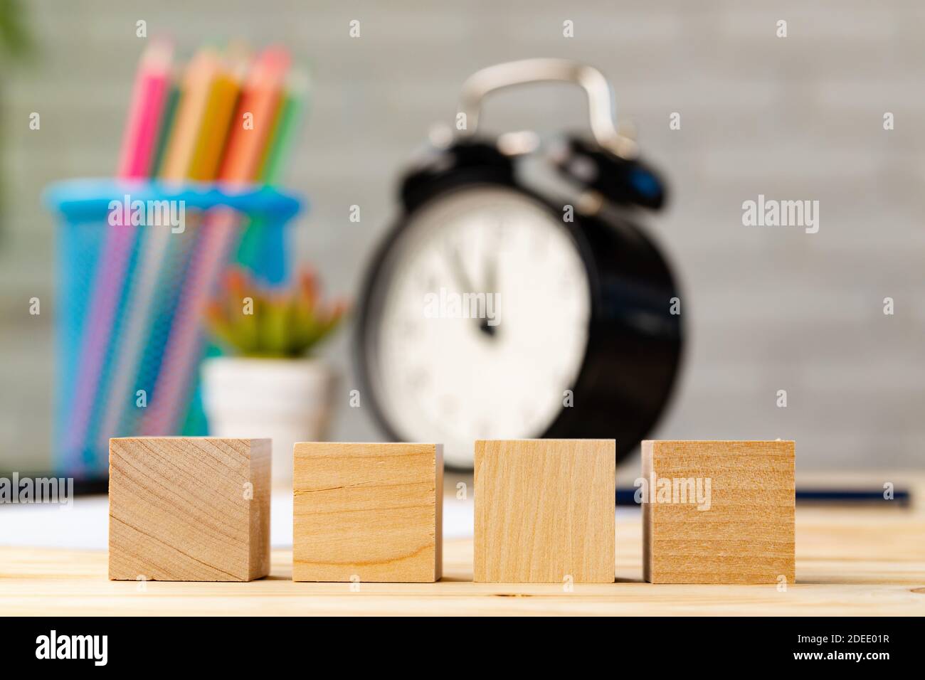 Alarm clock wooden blocks table hi-res stock photography and images - Alamy
