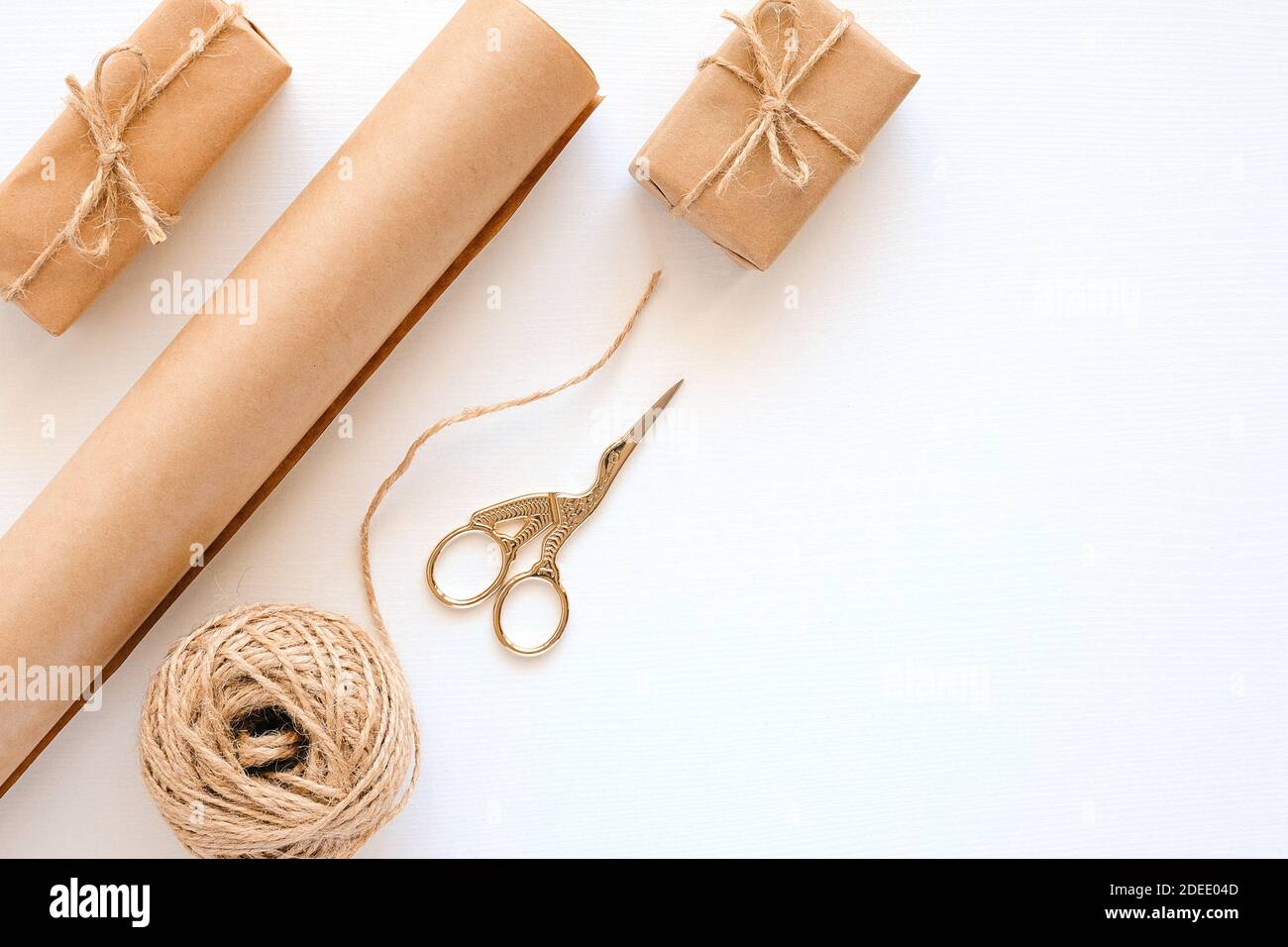 Set of materials for packing holiday gifts. Kraft paper, jute twine ...