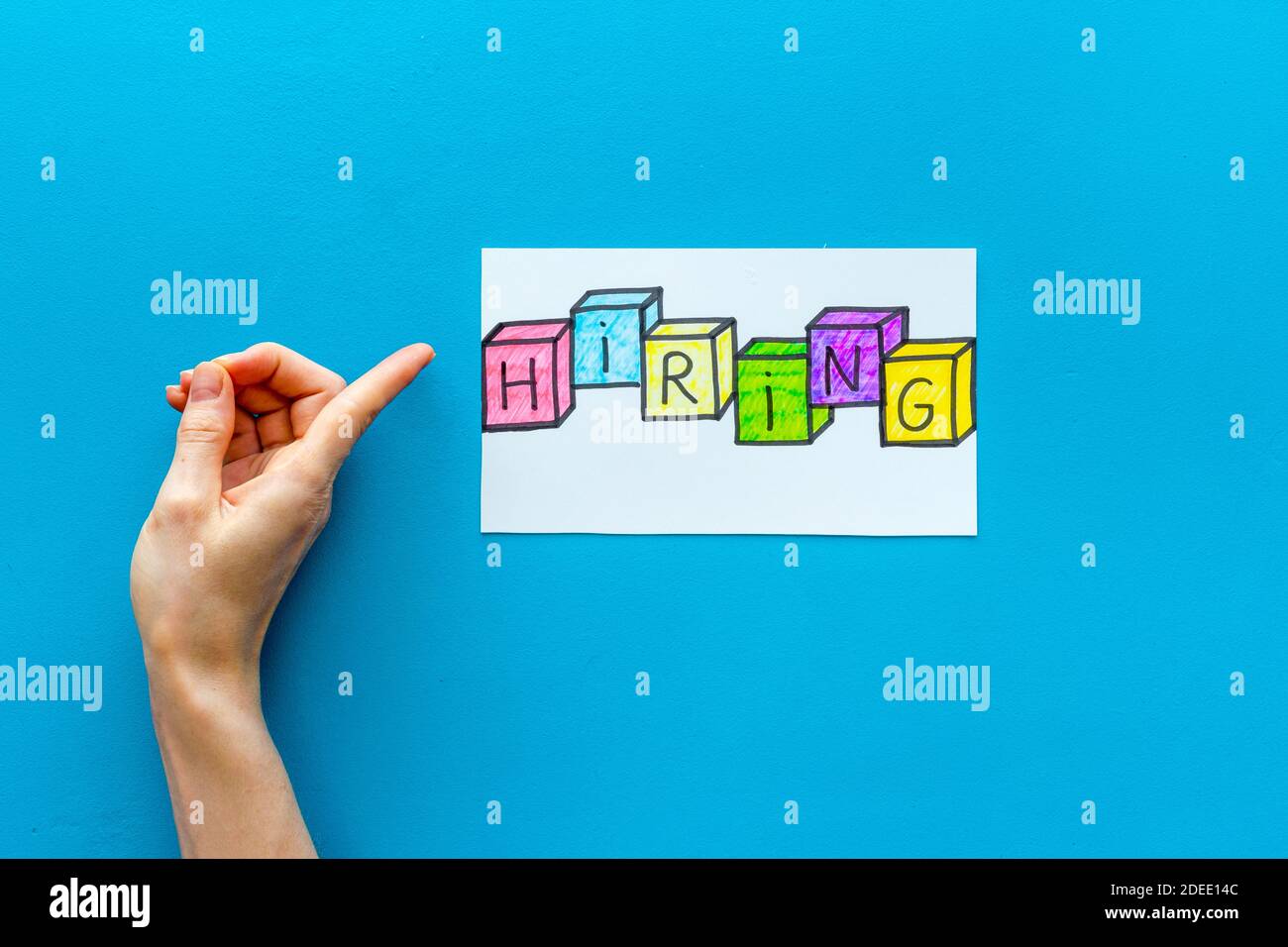 Hiring - job recruting concept. Word Hiring on paper banner, top view ...