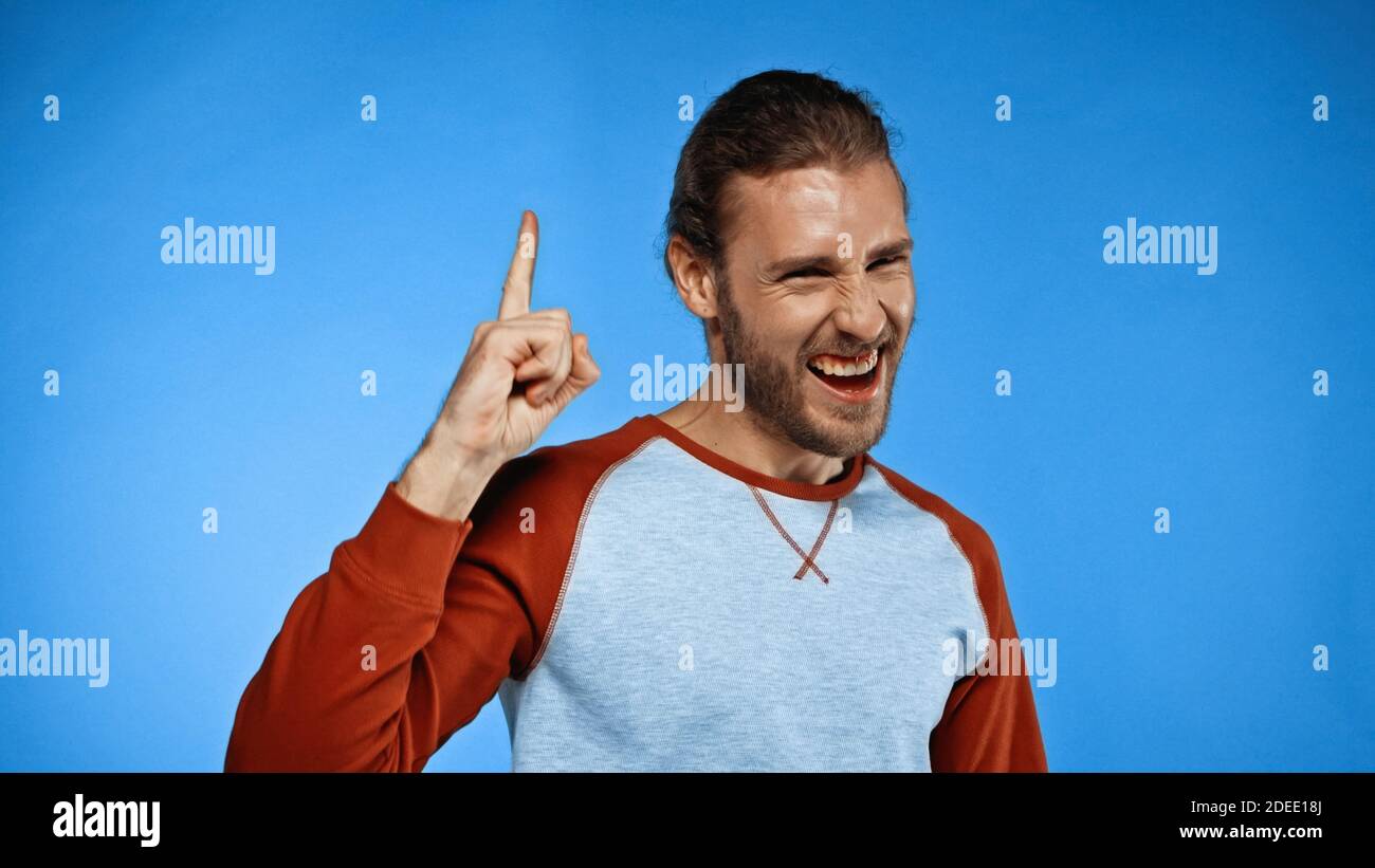 Excited young man pointing hi-res stock photography and images - Alamy