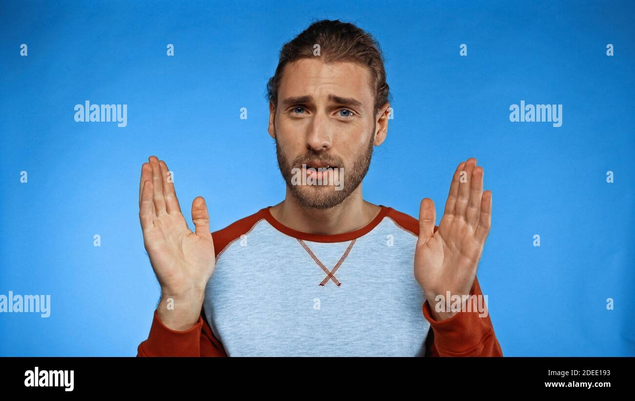 Confused bearded young man hi-res stock photography and images - Alamy