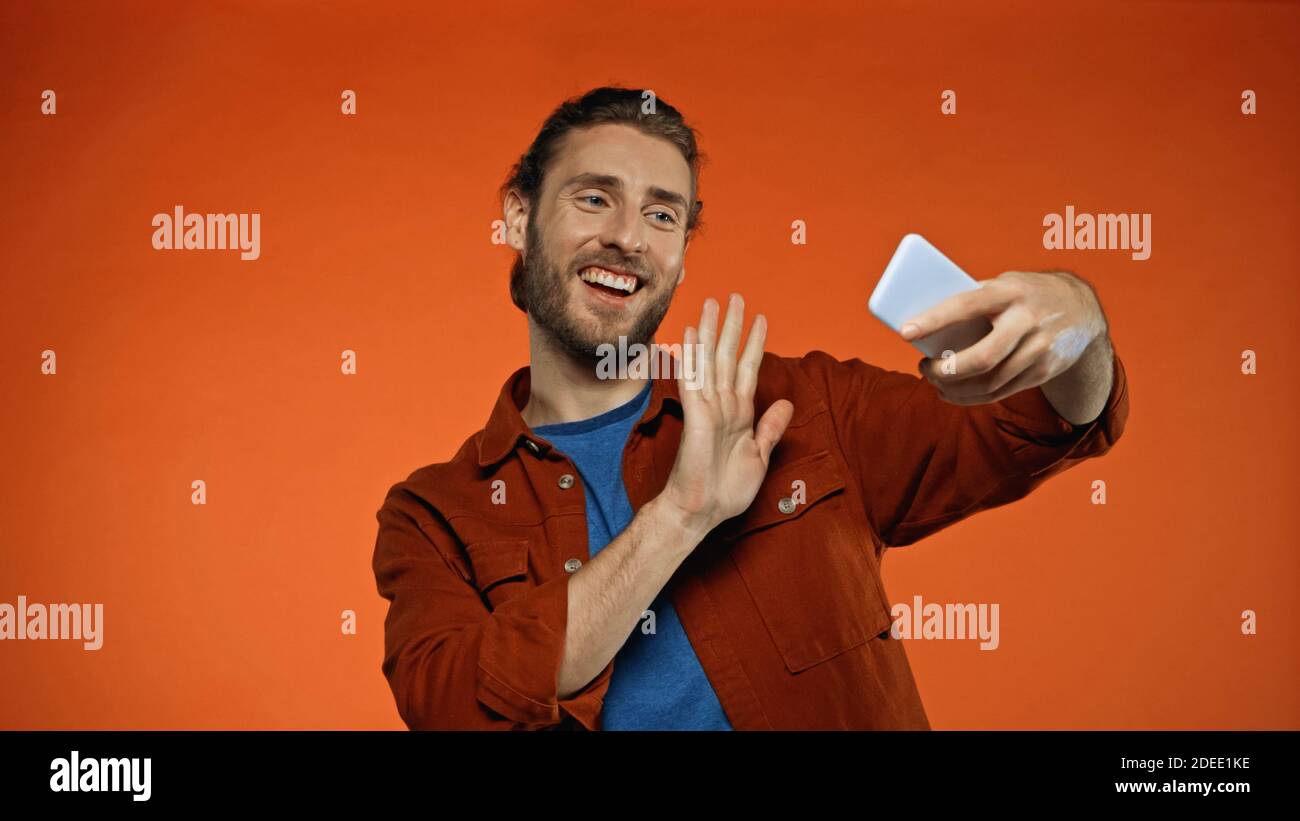 Positive young man waving hand hi-res stock photography and images - Alamy