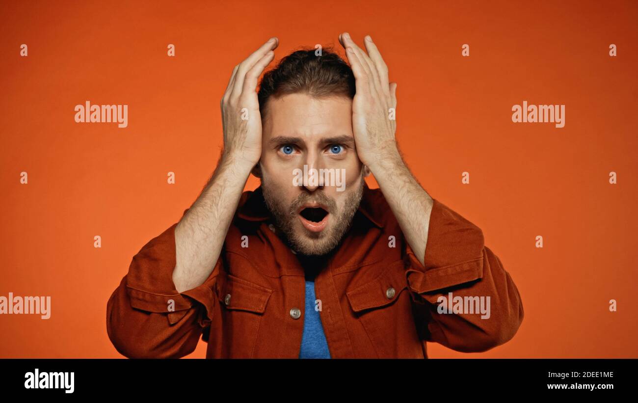 Shocked young man looking camera hi-res stock photography and images ...