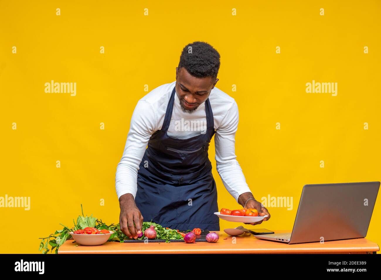Chef with a laptop computer hi-res stock photography and images - Alamy