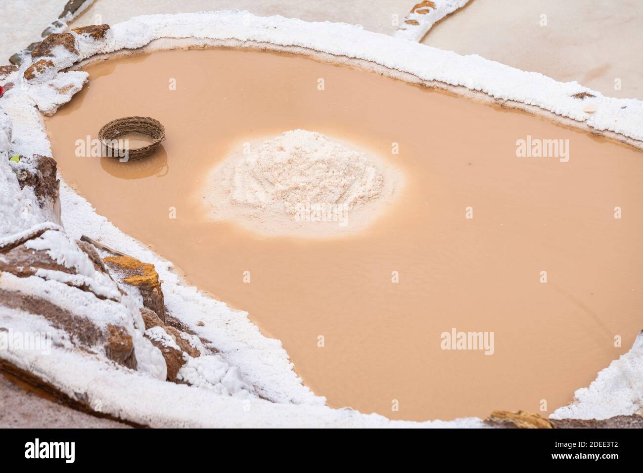 Pile of mined salt in the middle of salt field, Salineras de Maras ...
