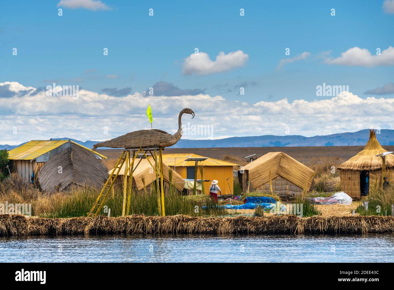 Uros Island with houses made out of reed and flamingo-like high seat ...