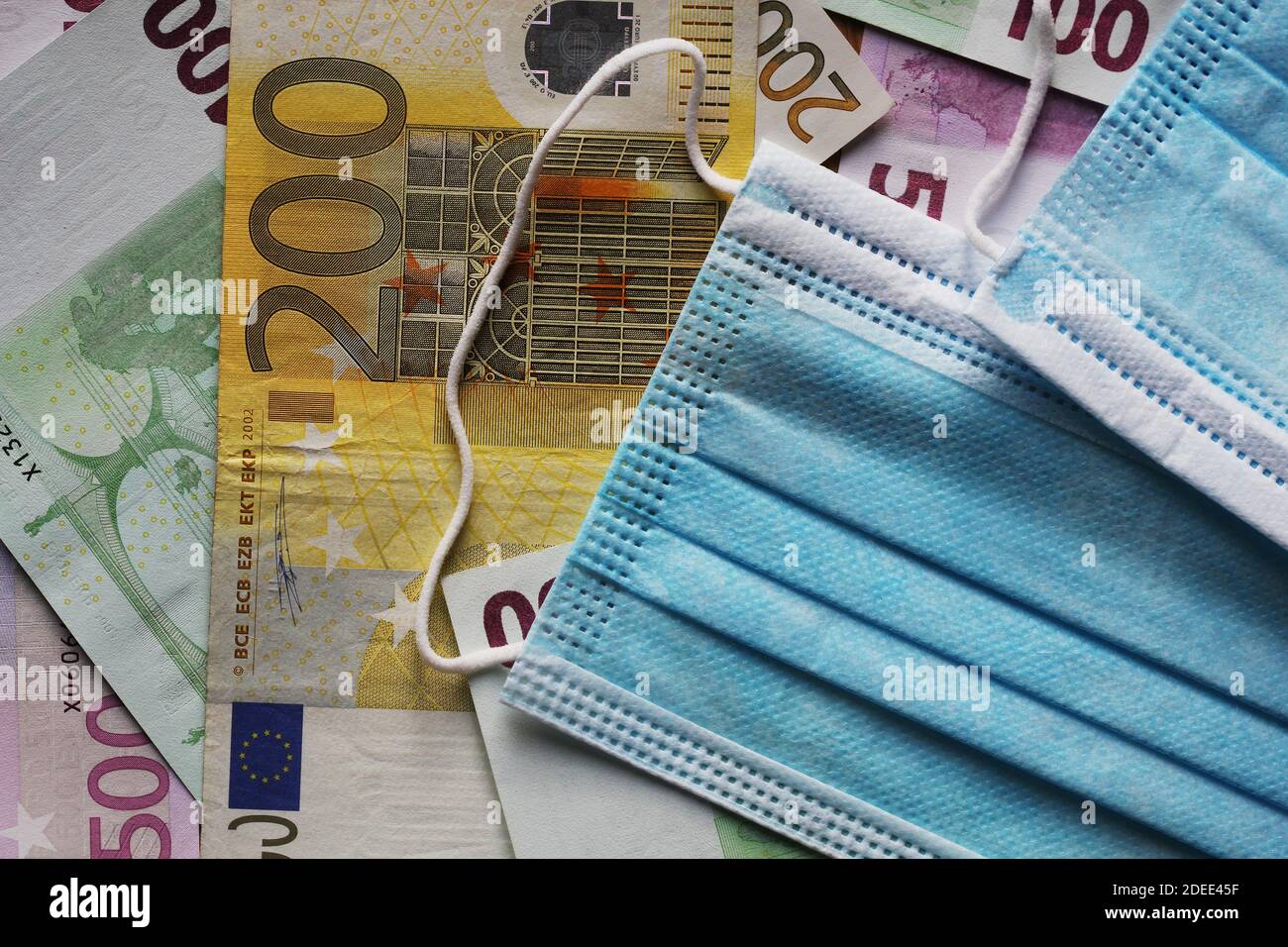 Medical face masks and money. Surgical face mask. COVID-19 Has Caused A ...