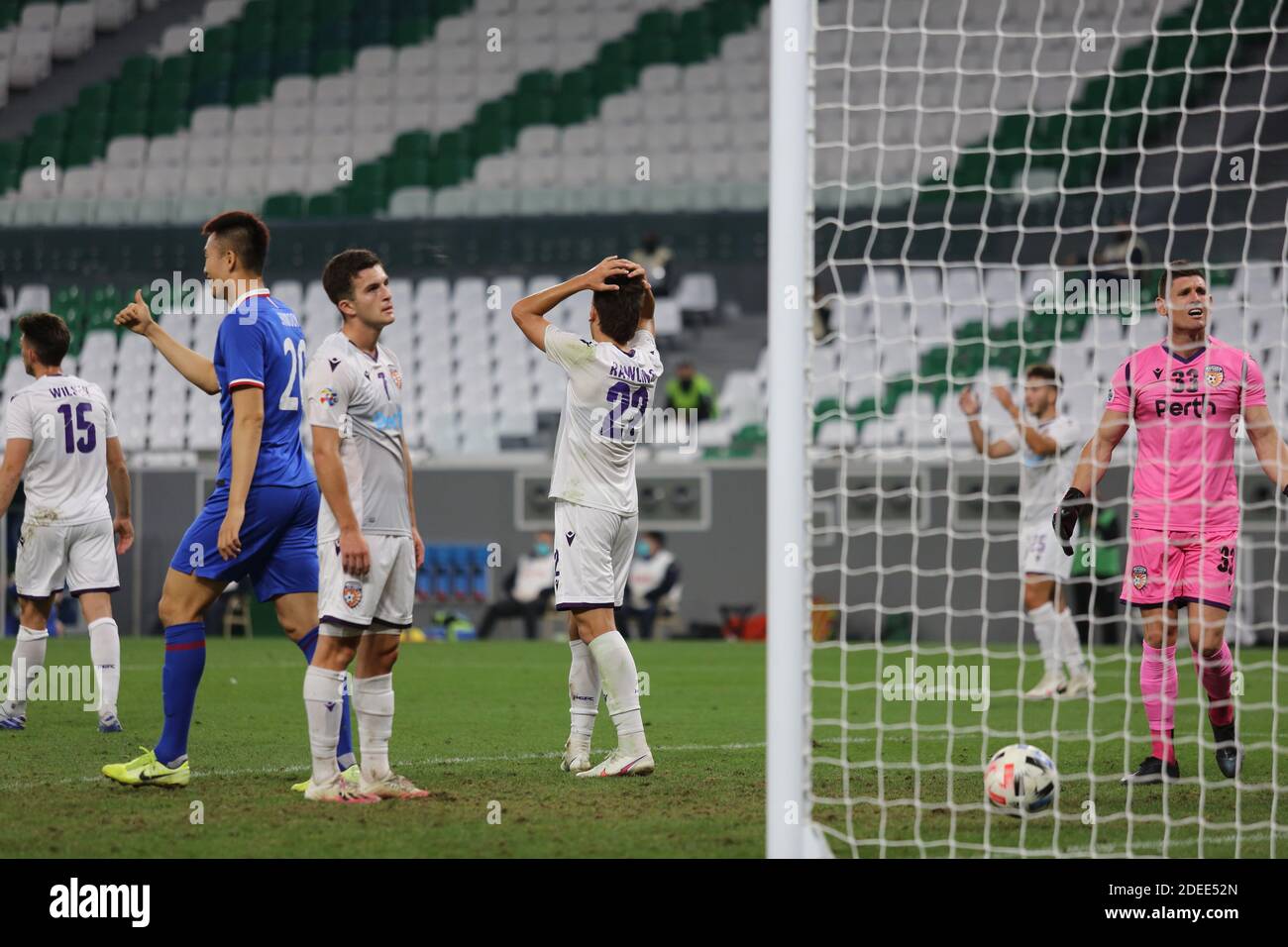 DOHA, QATAR - NOVEMBER 30: Joshua Rawlins of Perth Glory holds his head ...