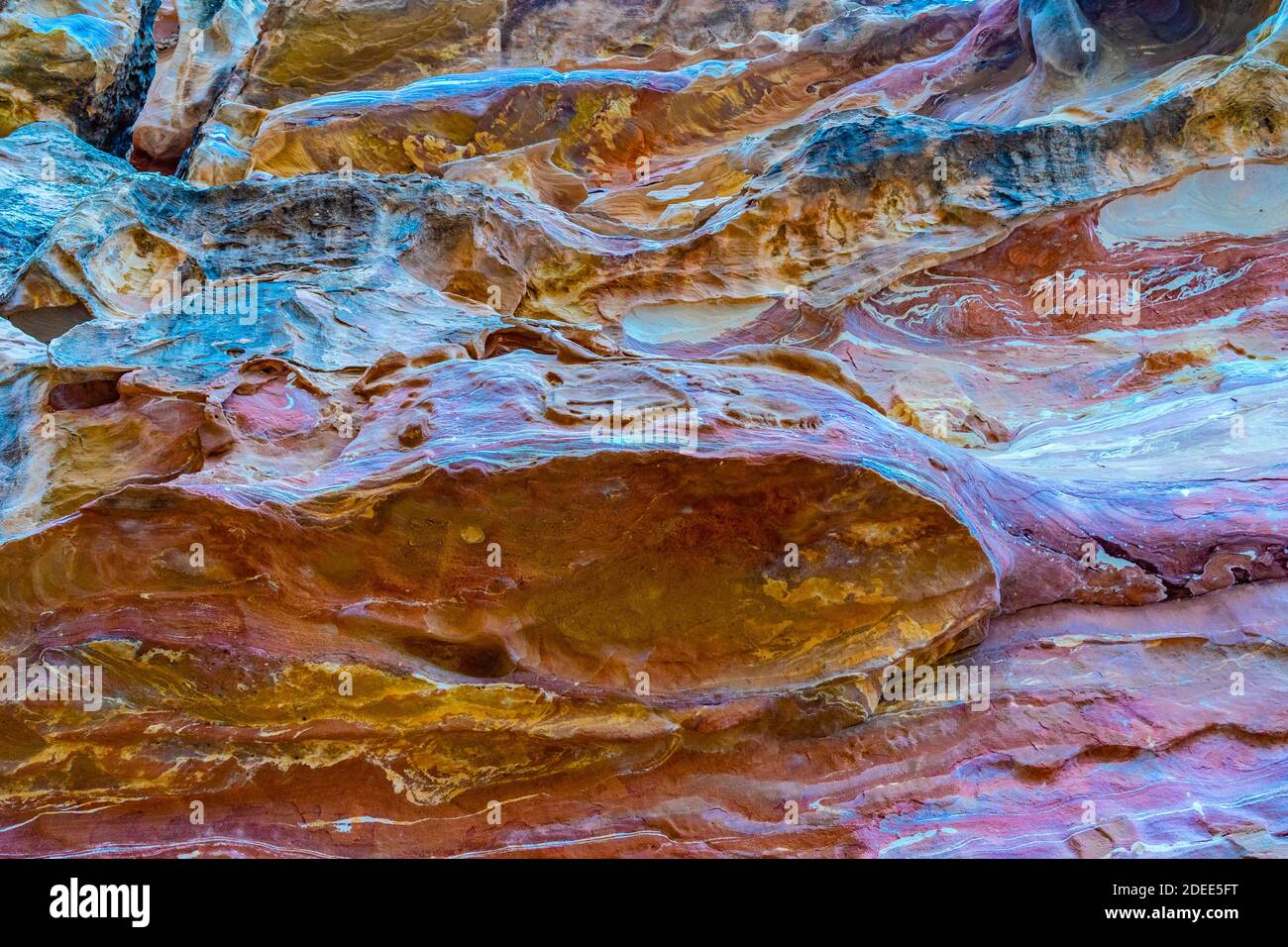 The multi-colored exposed sandstone rock and mineral layers in the ...