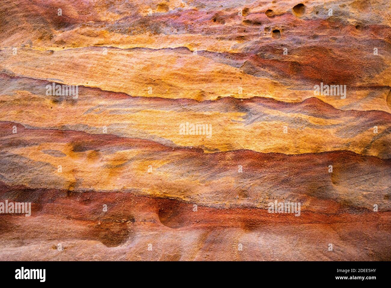 The multi-colored exposed sandstone rock and mineral layers in the ...