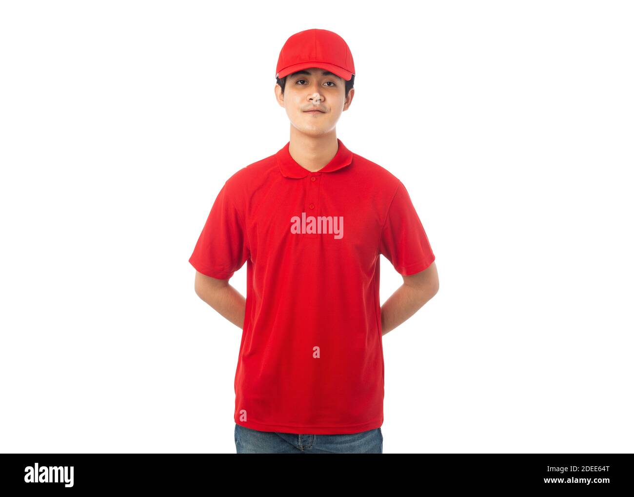 Young Delivery man in red uniform isolated on white background with ...
