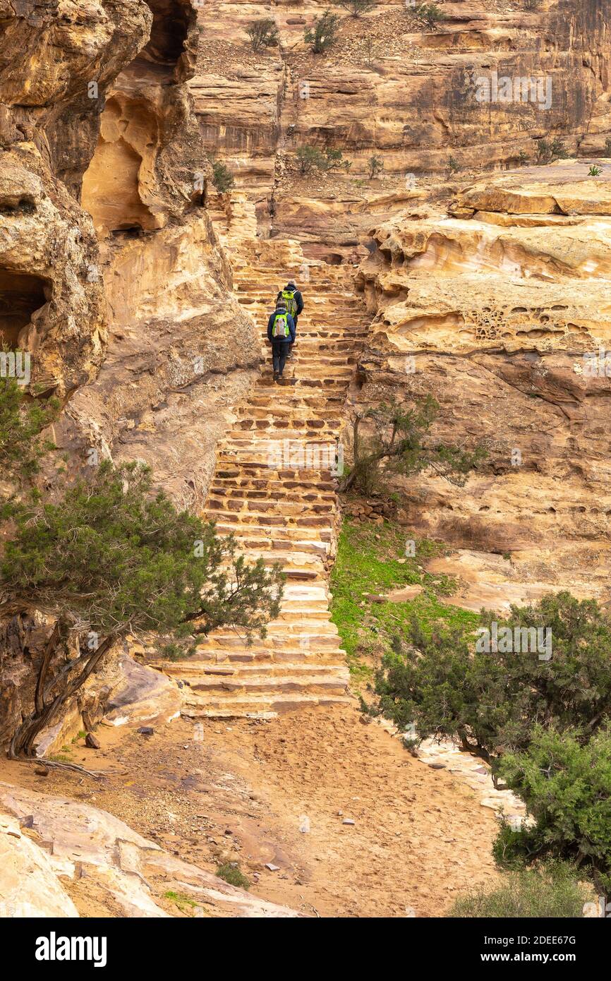 PETRA, JORDAN- JANUARY 13,2020: unidentified backpackers walks the ...