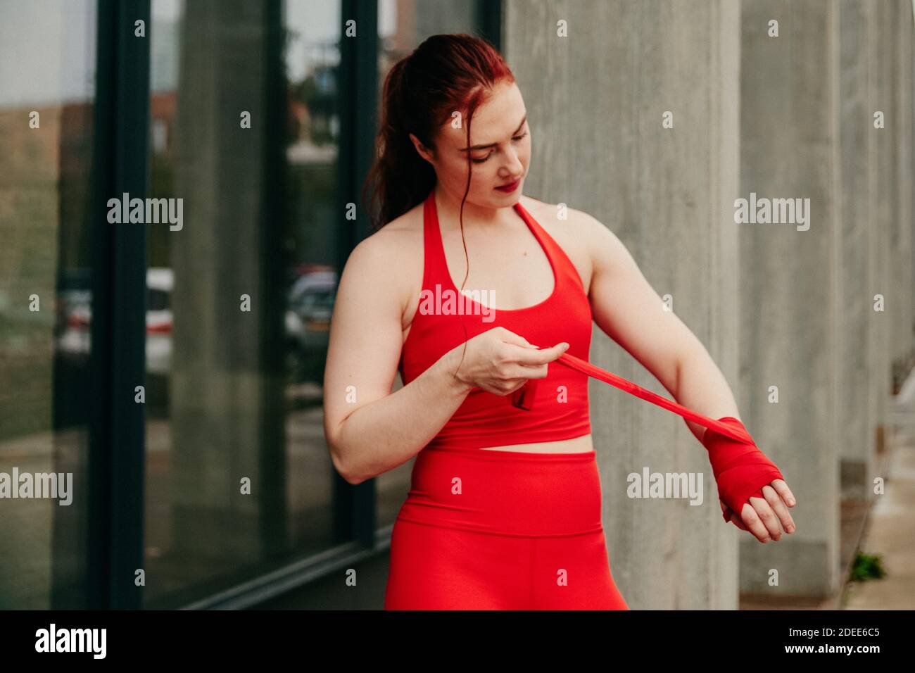Young female boxer, wrapping wrist for boxing in Brooklyn street Stock ...