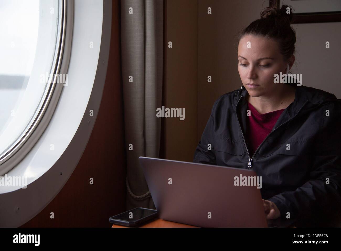 A female working remotely on a ship Stock Photo - Alamy