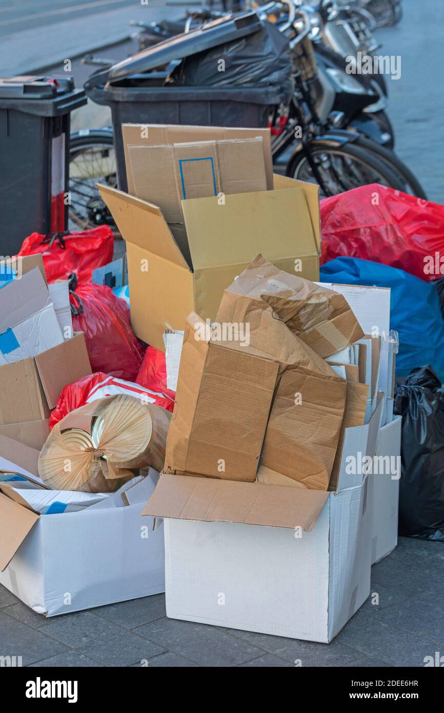 Carboard Boxes and Garbage Bags Trash at Street Stock Photo - Alamy