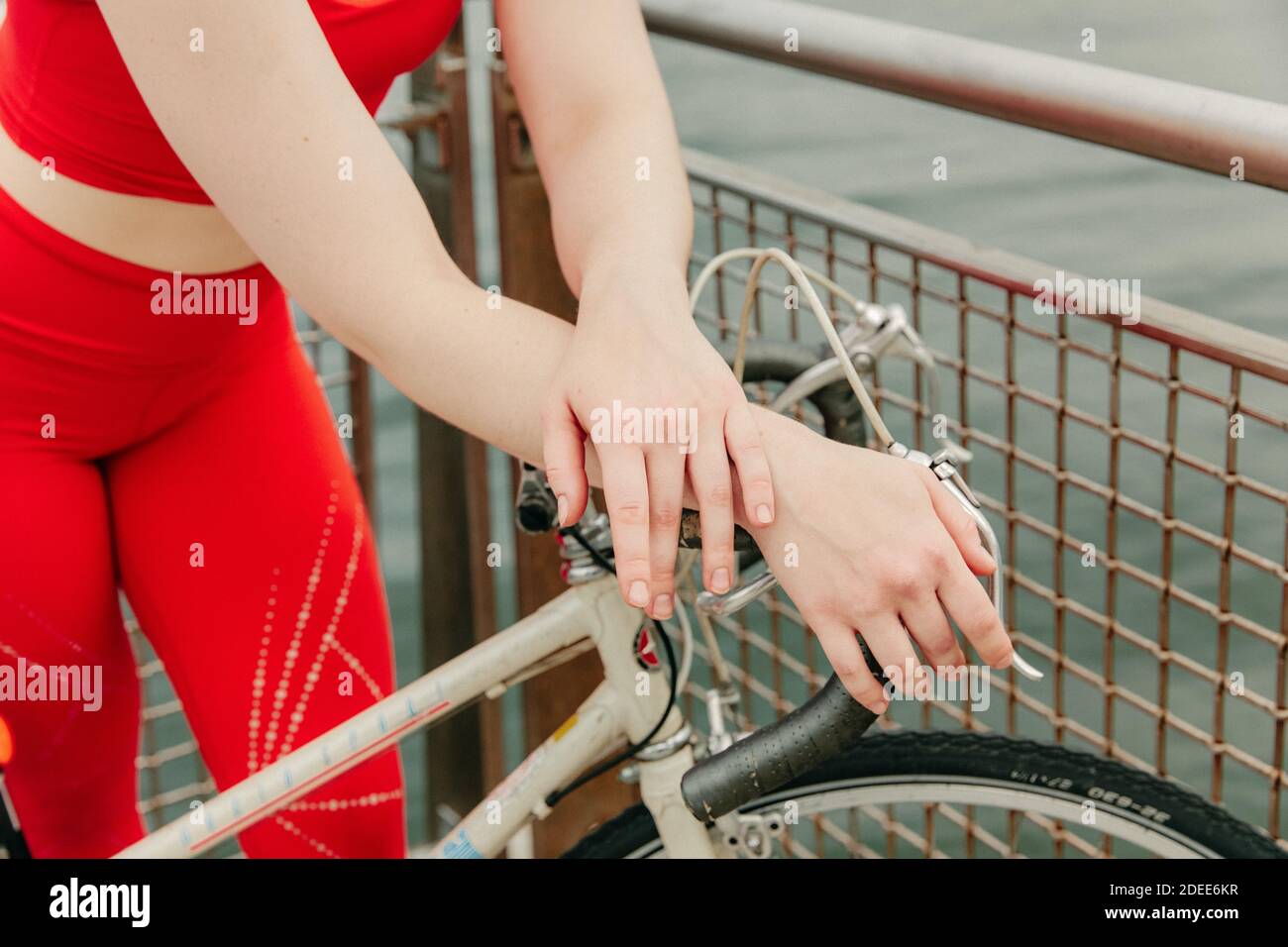 Young female cyclist's hands with bike by Brooklyn waterfront Stock ...