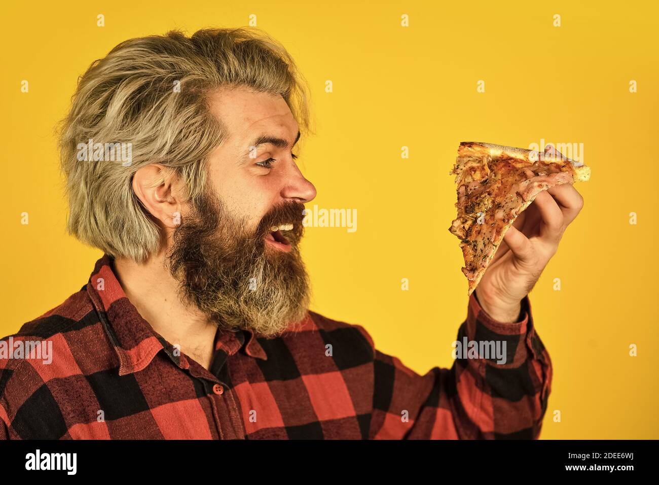 bearded male chef cook or baker man. Hold italian pizza slice. man from ...