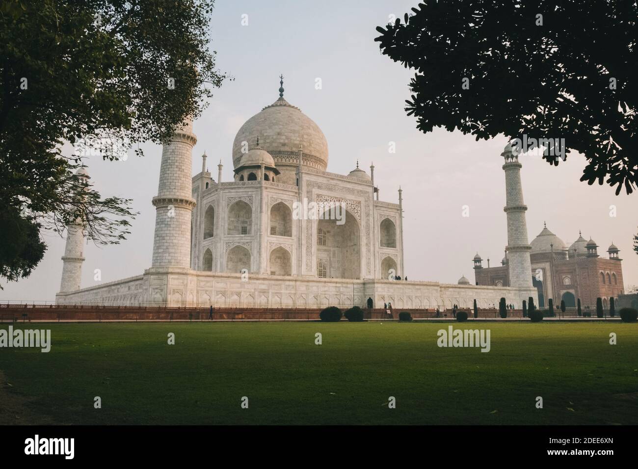 Taj Mahal surrounded by trees in the symmetrical gardens around the ...