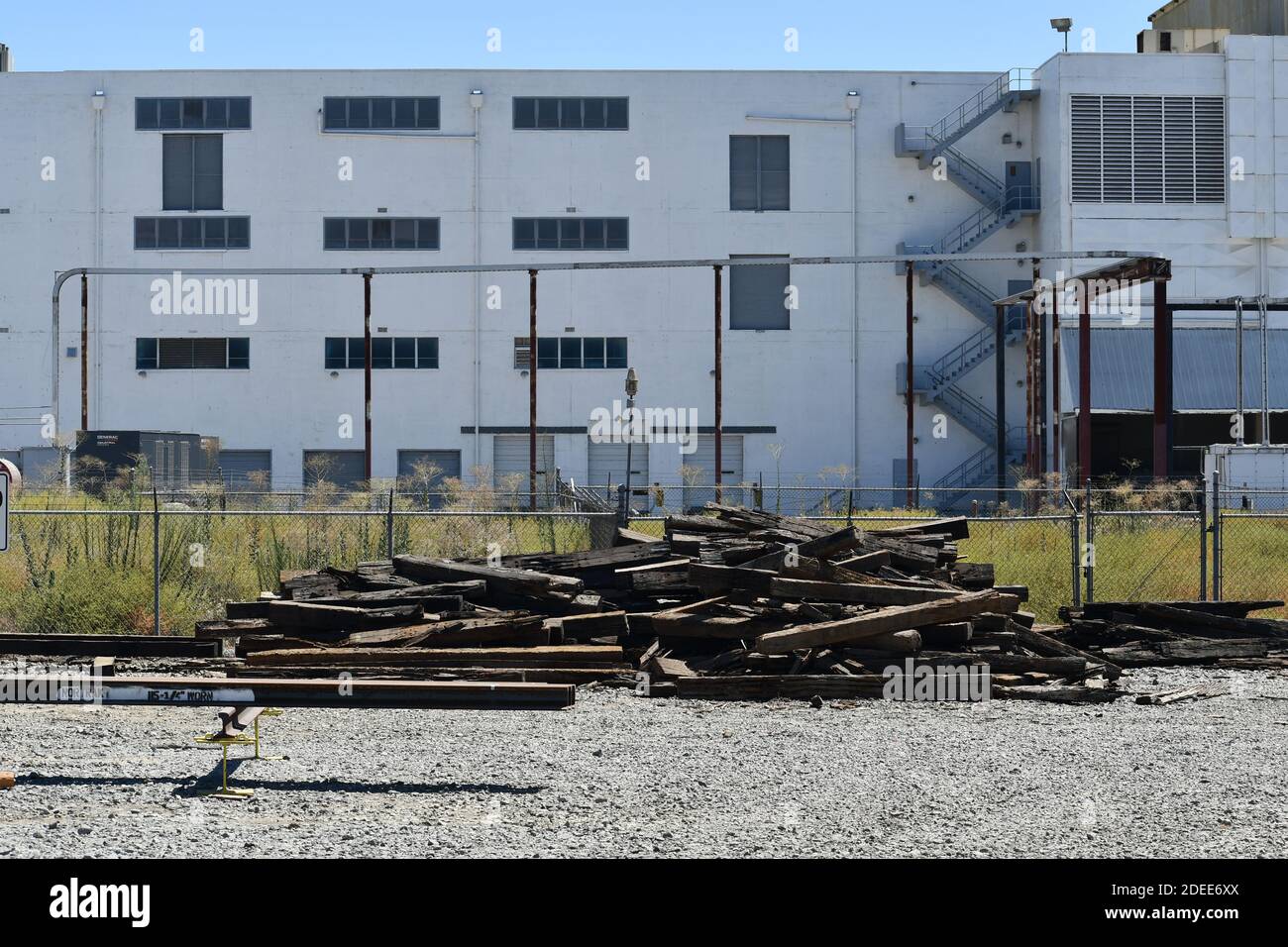 An old factory area with chopped wooden log materials for construction ...