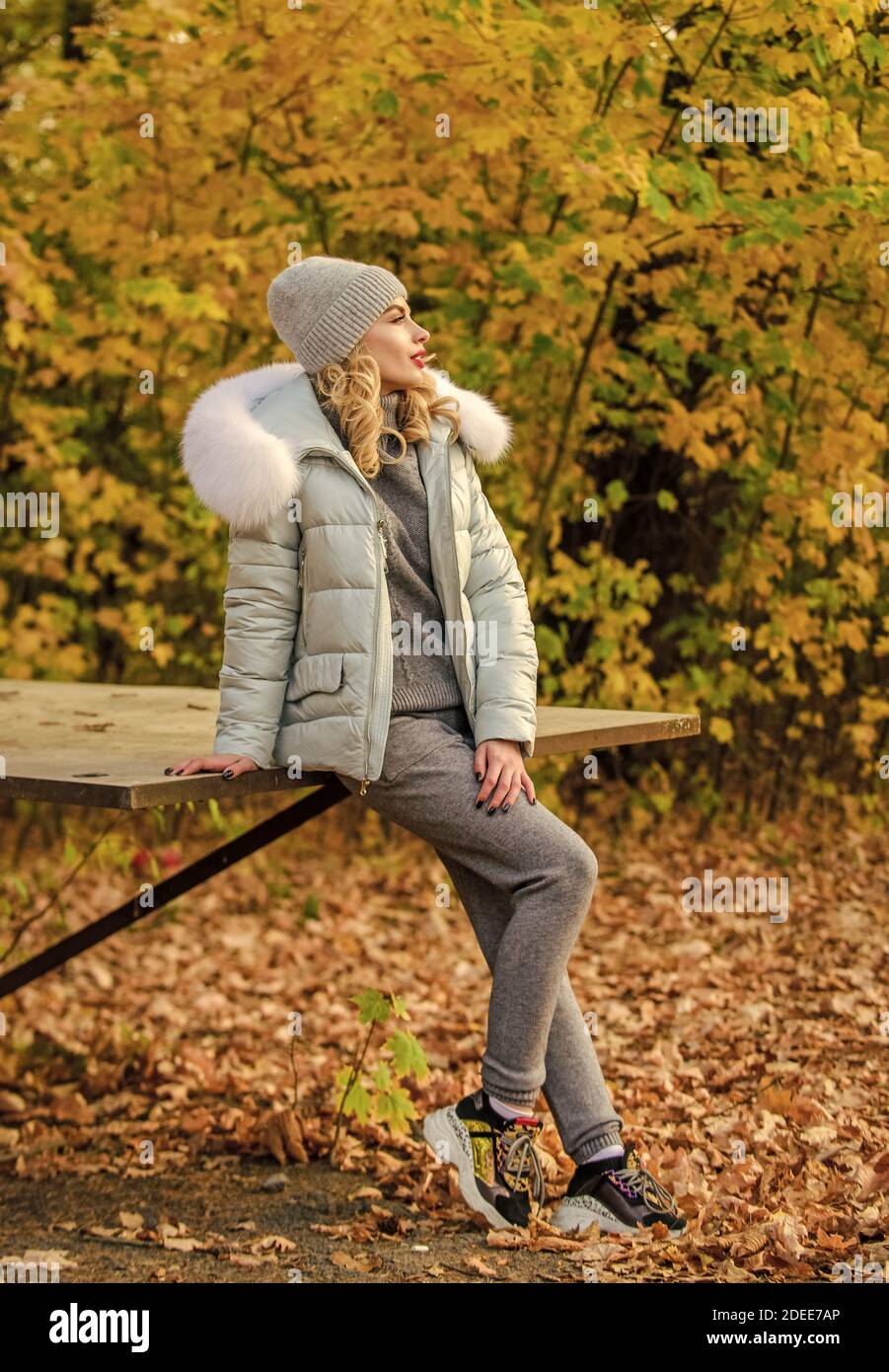 Clothes for rest. Girl relaxing in nature wearing knitwear suit and ...
