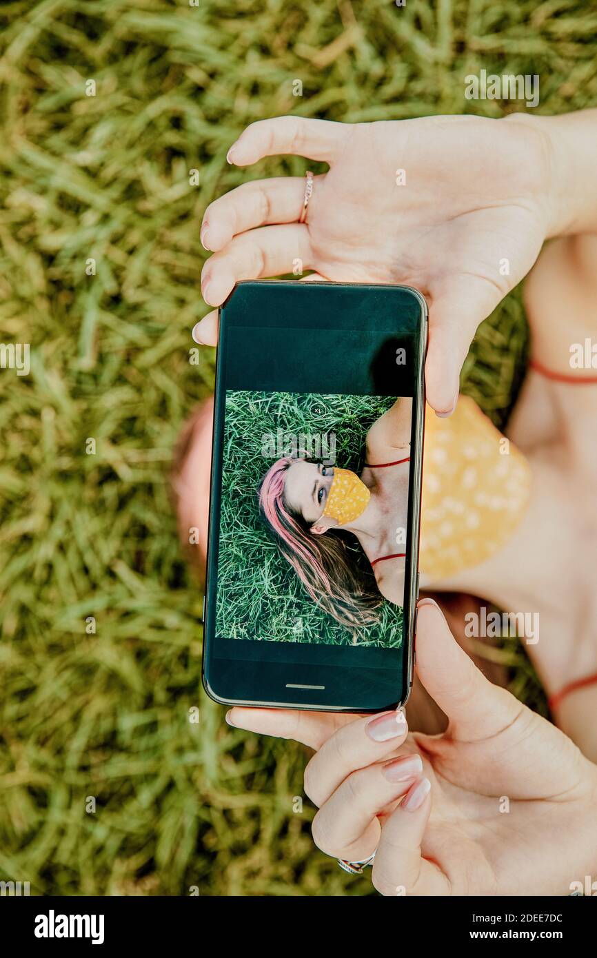 Woman wearing facemask taking hi-res stock photography and images - Alamy