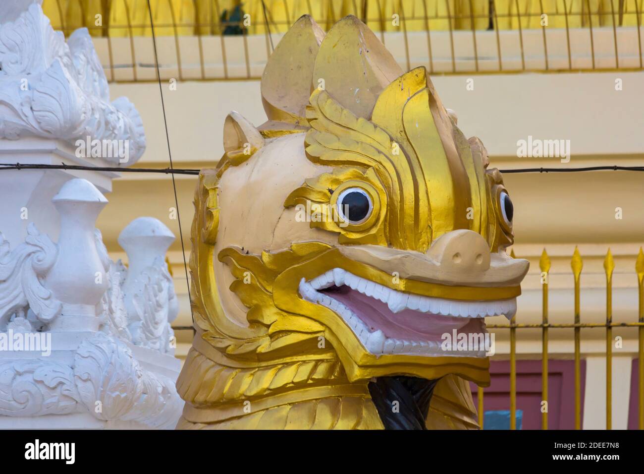 Golden chinthe (half lion, half dragon) statue sculpture at Shwedagon ...