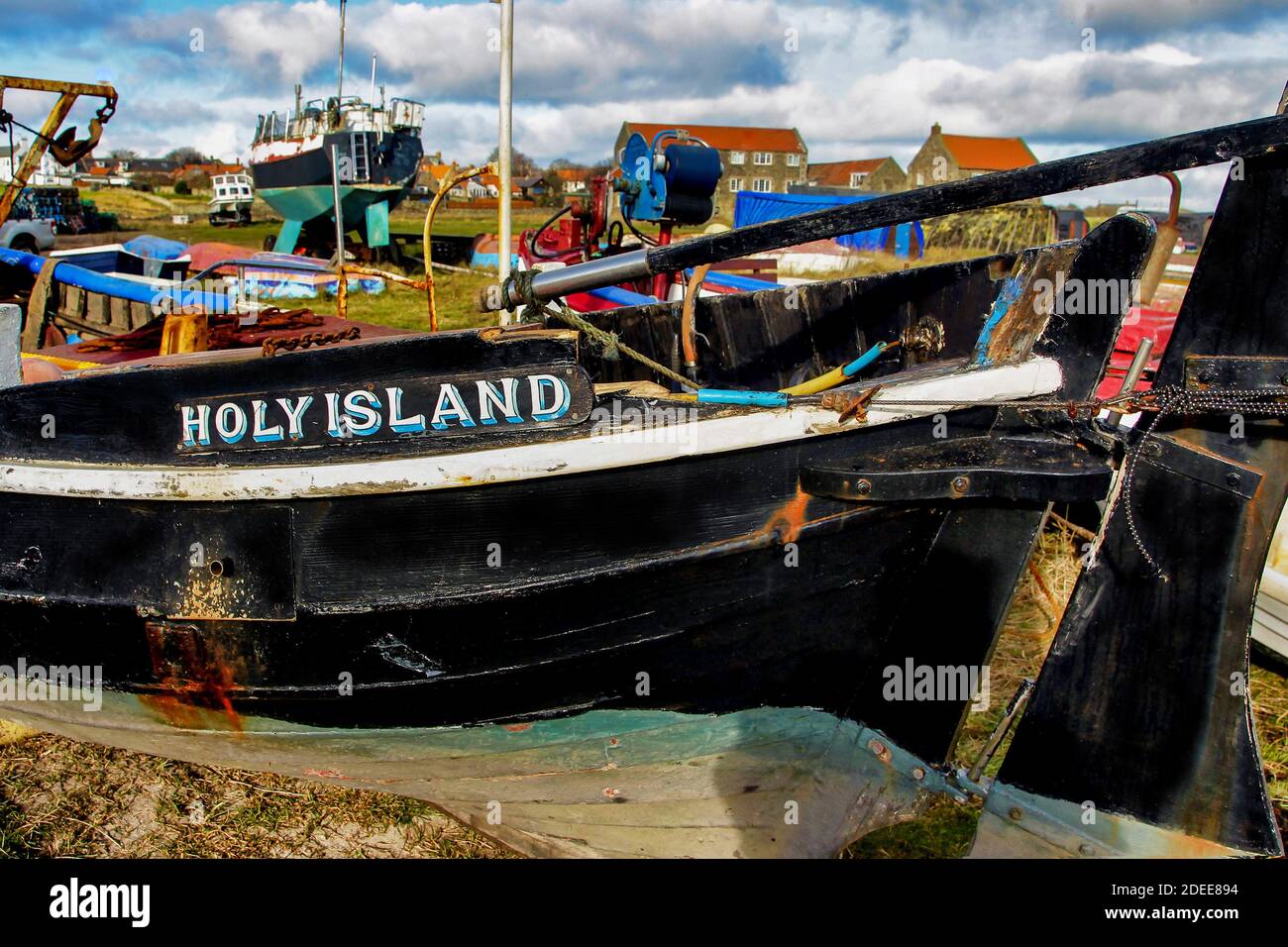 Old beached fishing boat on a lot on the holy Island of Lindisfarne ...