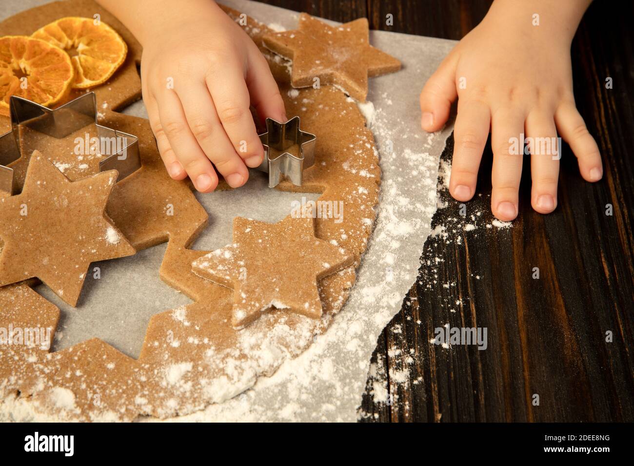 Close-up child hands making festive decorations and homemade ...