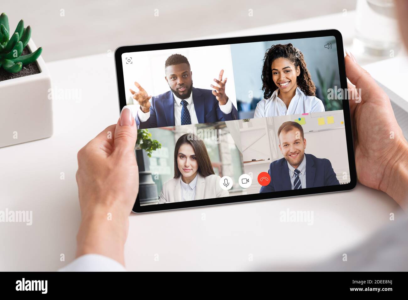 Business People Having Group Video Call Online Via Tablet Indoor Stock ...