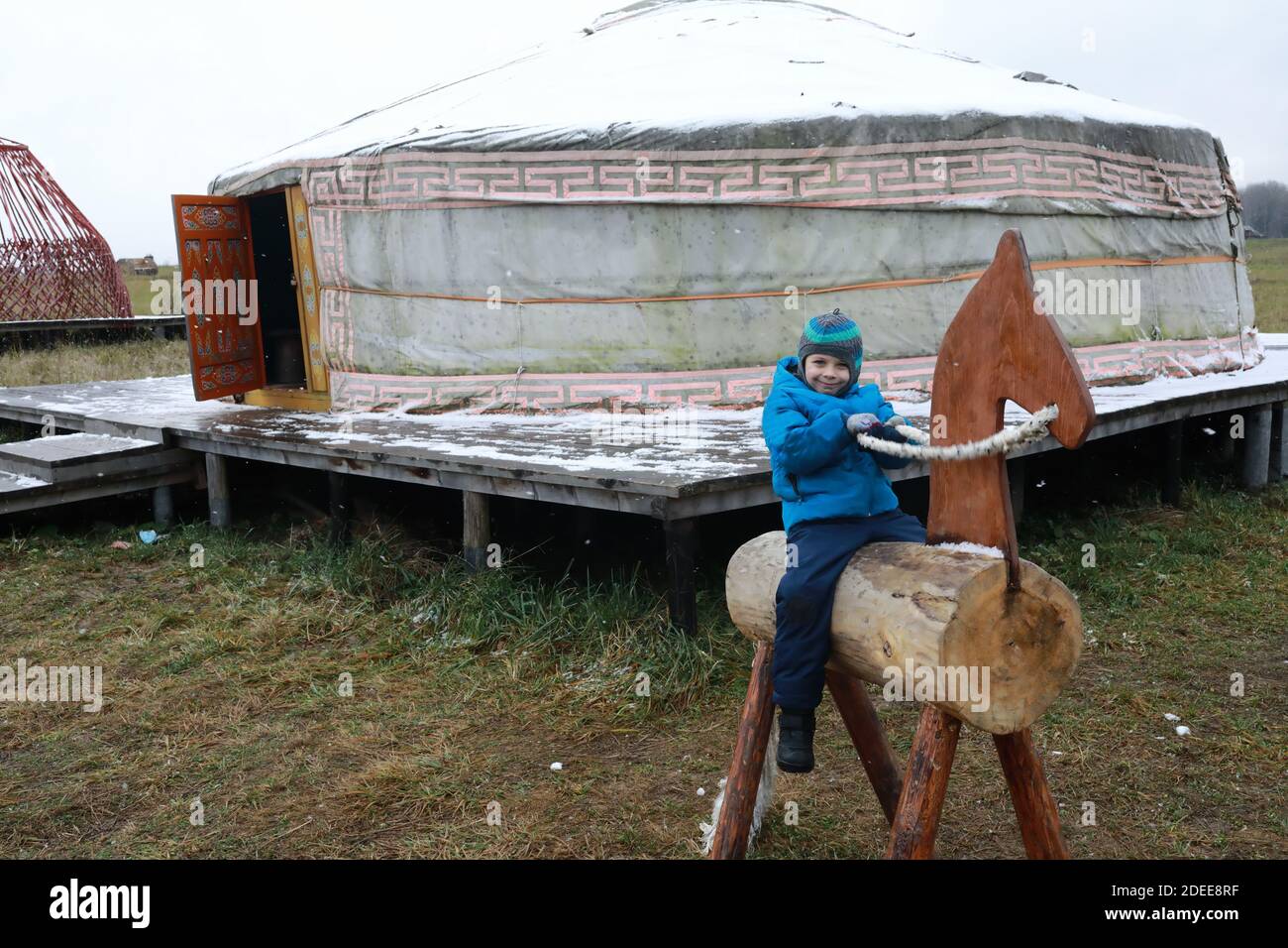 Child sitting on wooden horse in front of Yakut yurt Stock Photo - Alamy