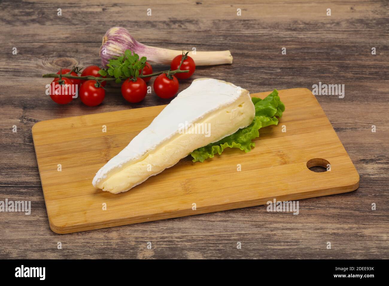 Brie cheese triangle served salad leaves Stock Photo - Alamy
