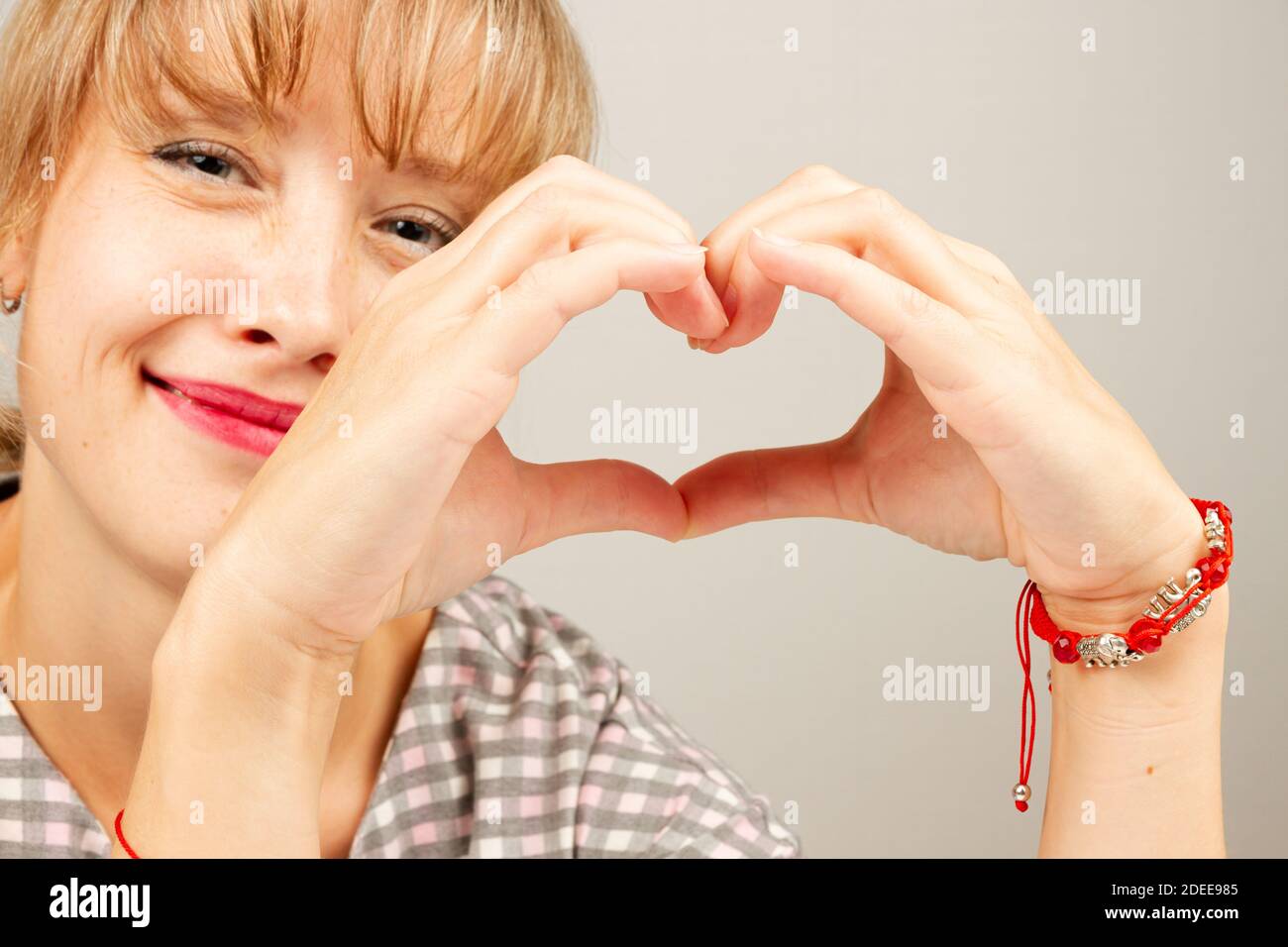 beautiful girl showing signs with her hands Stock Photo - Alamy