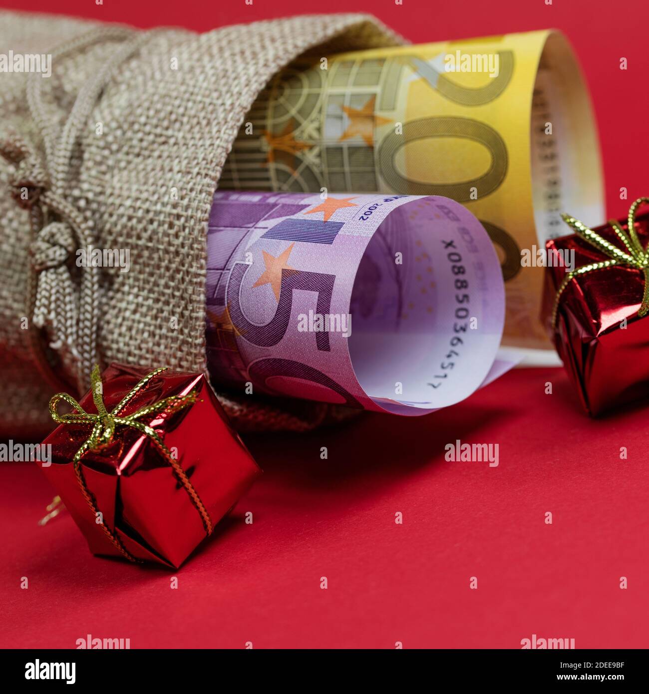 Banknotes, Christmas money in a jute bag against a red background Stock ...