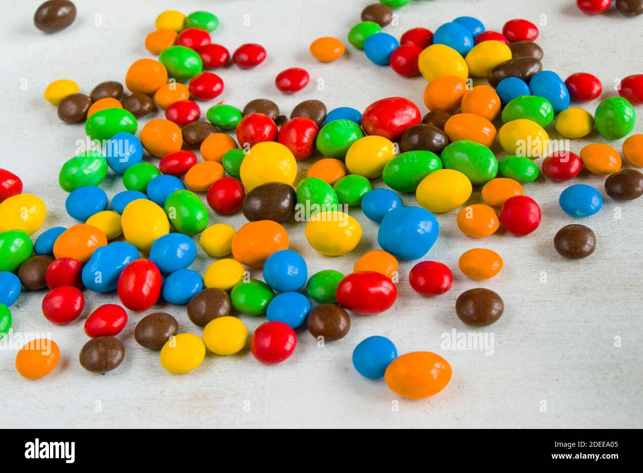 Chocolate candy on the white background, colorful candy texture, close ...
