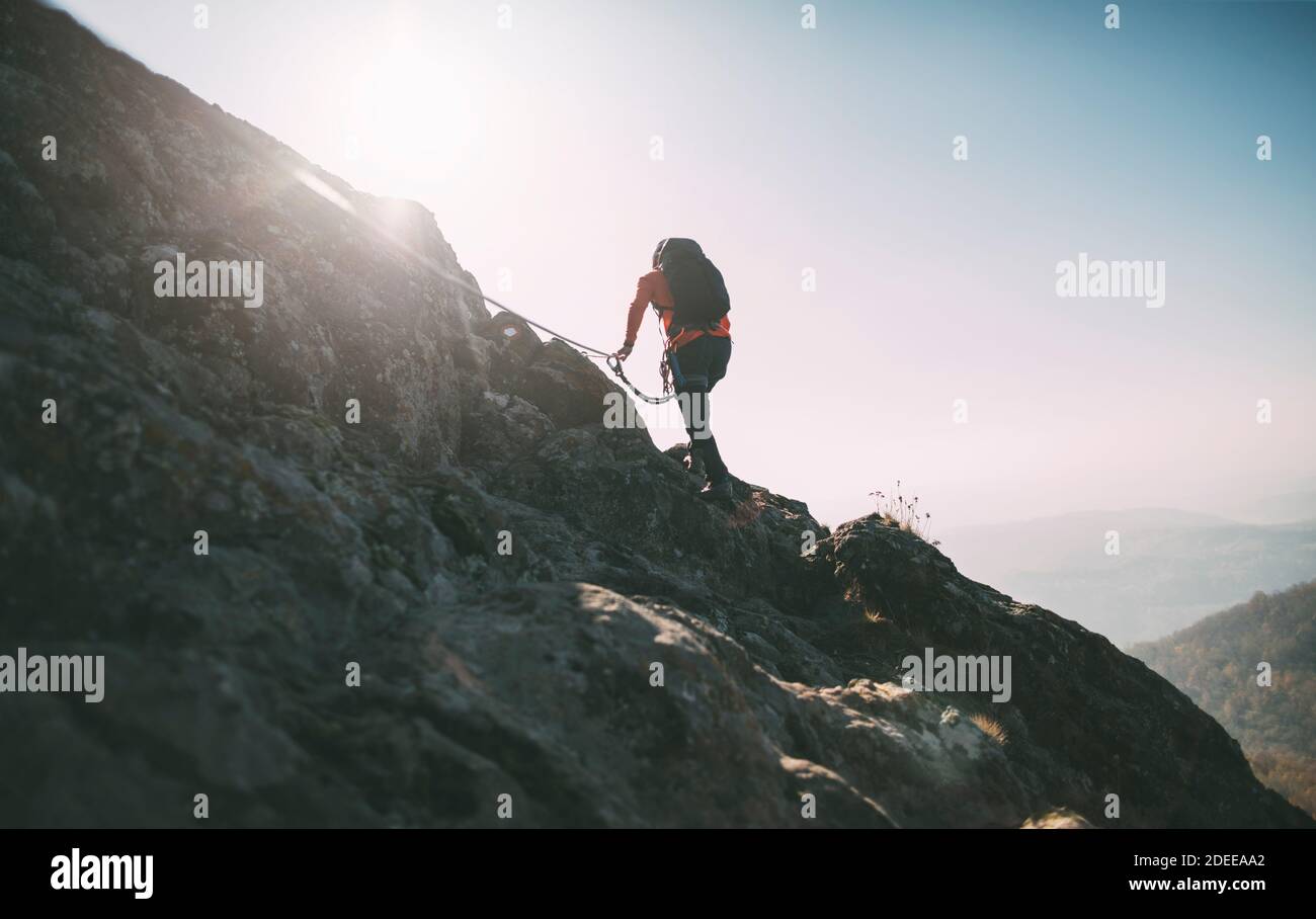 Rear view of a man rock climbing hi-res stock photography and images ...