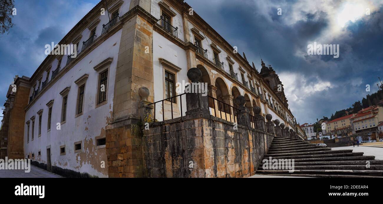 A panoramic shot of Alcobaca Monastery in Portugal under a cloudy sky ...