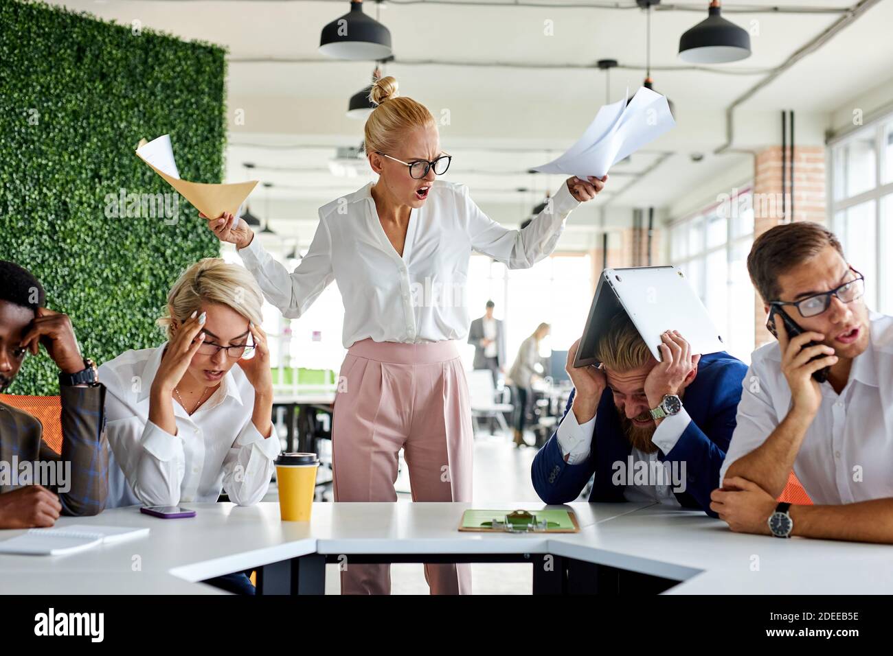 rude angry female boss executive is dissatisfied irritated by employees ...
