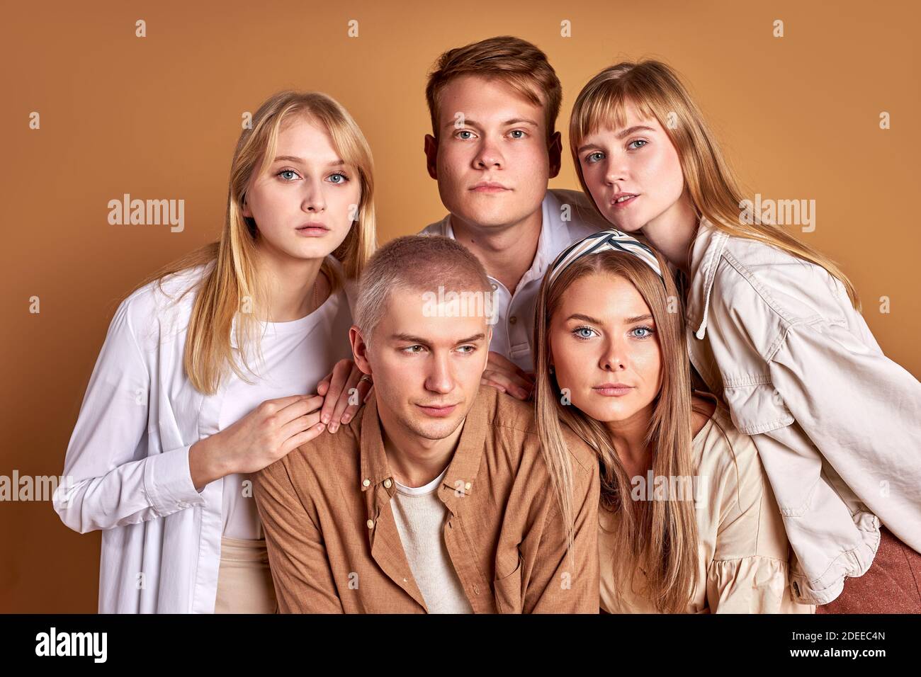 unusual group of extraordinary youth posing in trendy wear, caucasian ...