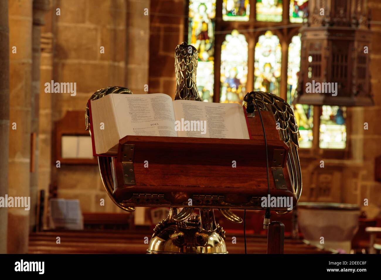 Church rostrum with a large open prayer book and a decorated brass ...