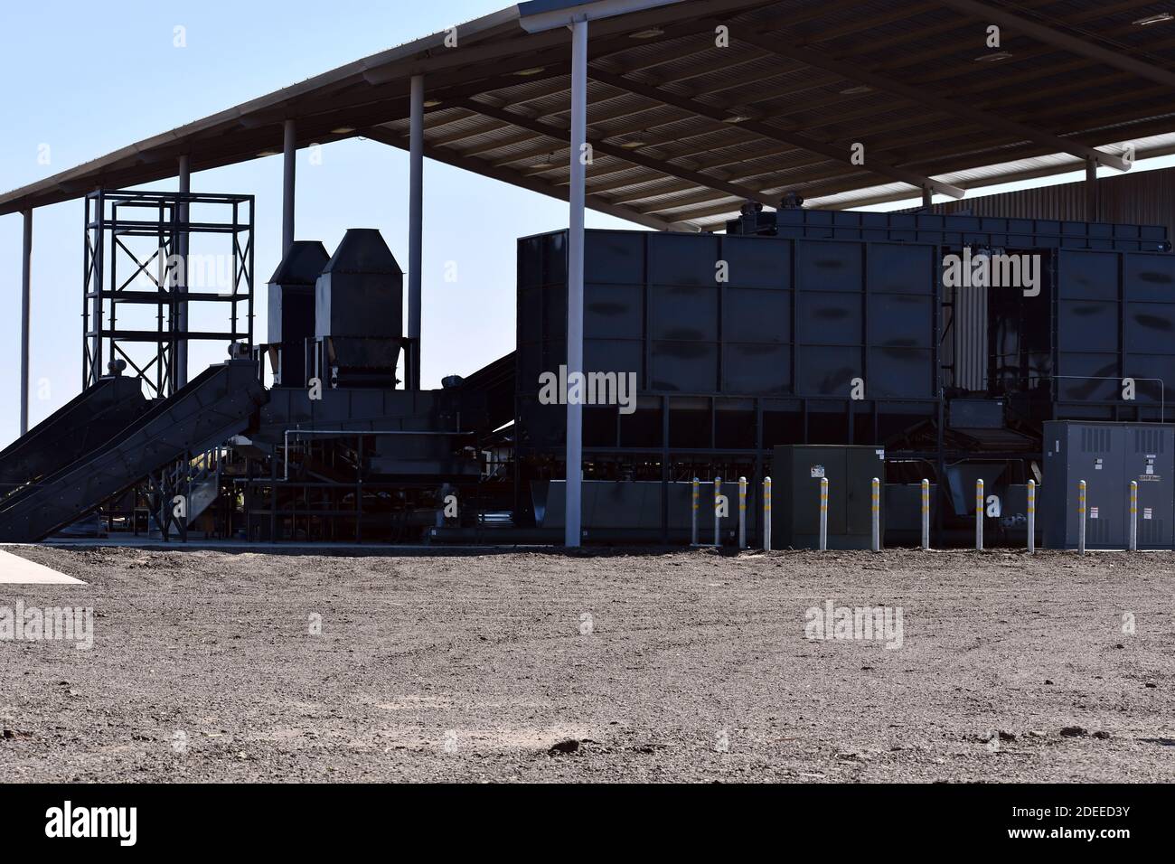 An old industrial area with metal pieces of equipment and containers ...