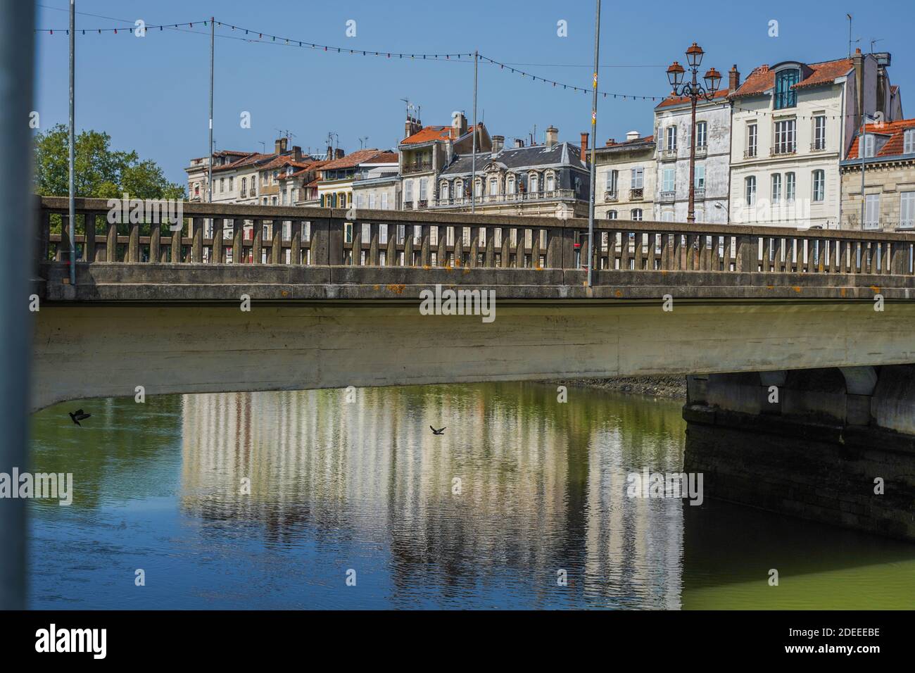 The beautiful city of Bayonne in France with buildings in the Nive ...